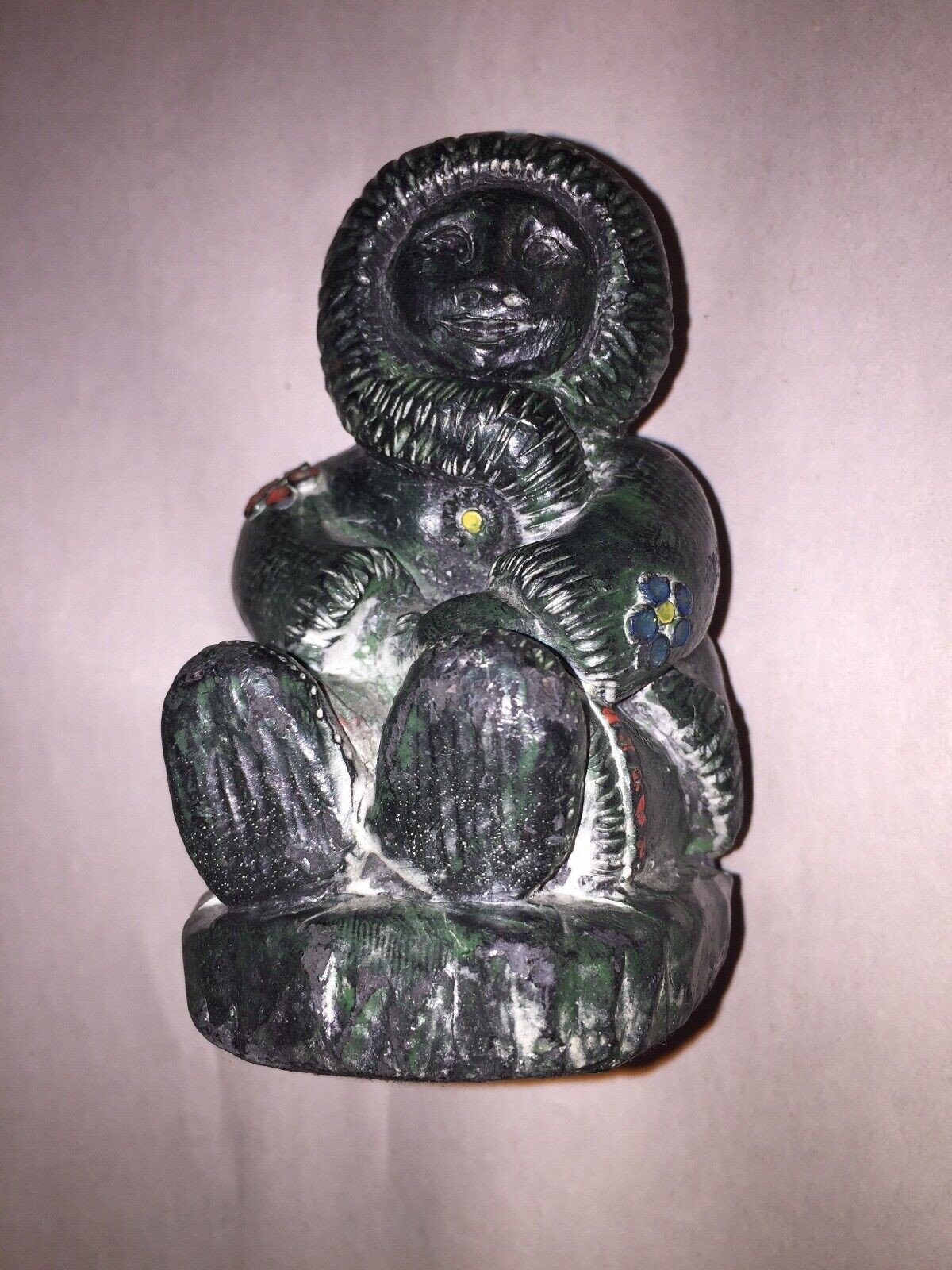 Inuit Woman Carving in Parka with Flowers